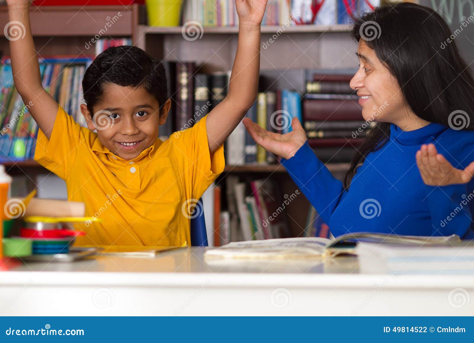 Hispanic Mom and Child Celebrating Reading Achievement Stock Photo ...