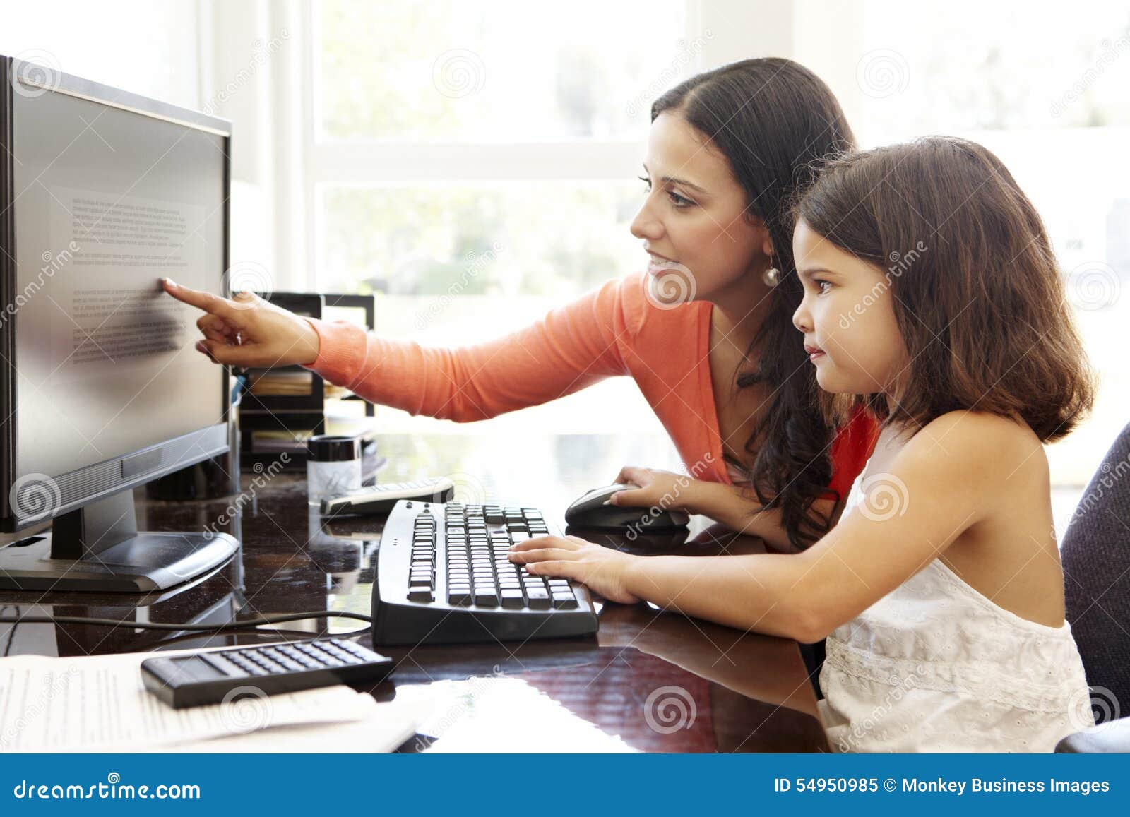 Hispanic Mother and Daughter Using Computer at Home Stock Image - Image ...