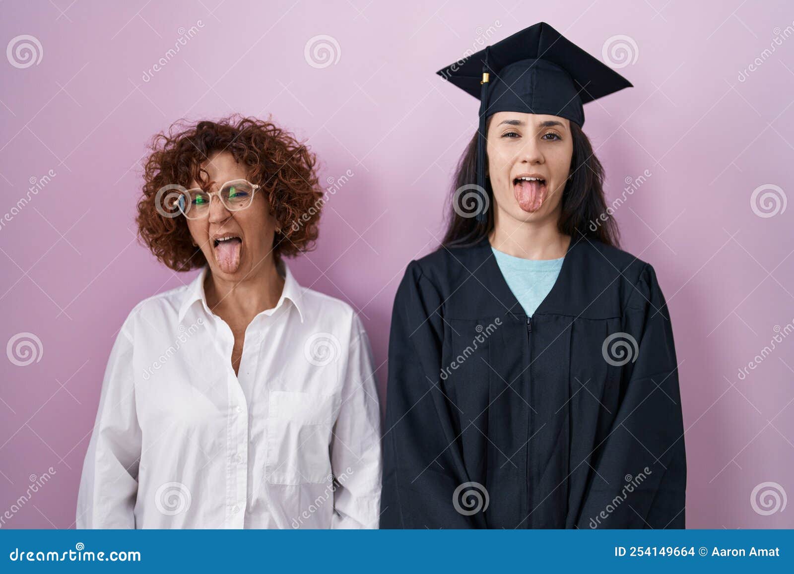 Hispanic Mother and Daughter Wearing Graduation Cap and Ceremony Robe ... Hispanic Mother and Daughter Wearing Graduation Cap and Ceremony Robe ...