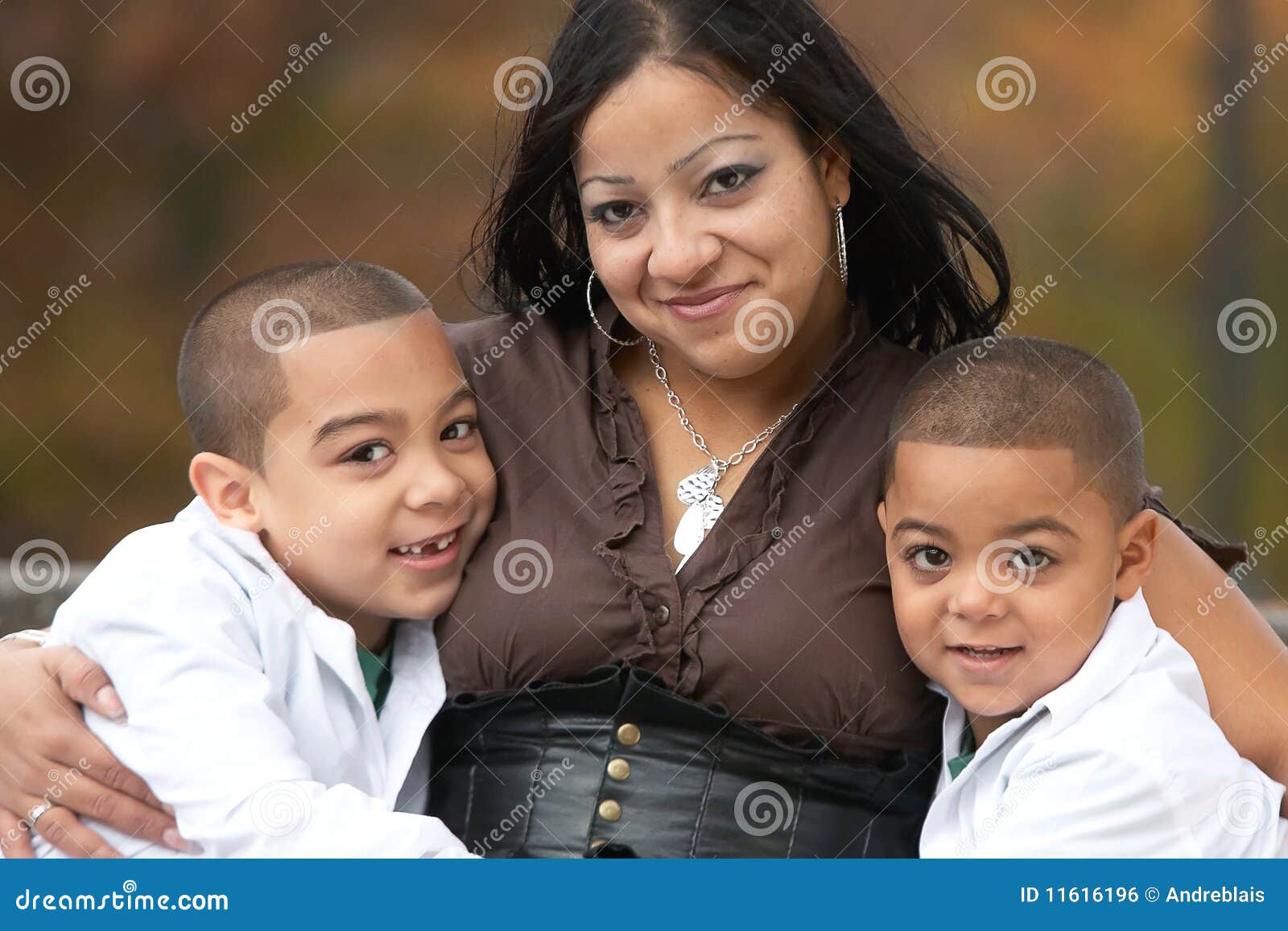 Hispanic mother with sons stock photo. Image of love - 11616196