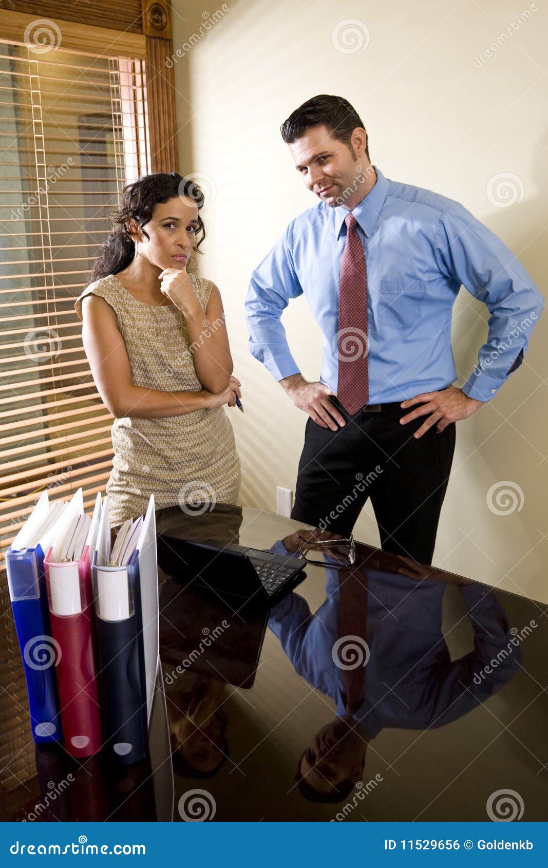 Hispanic Office Worker Working with Male Colleague Stock Photo - Image ...