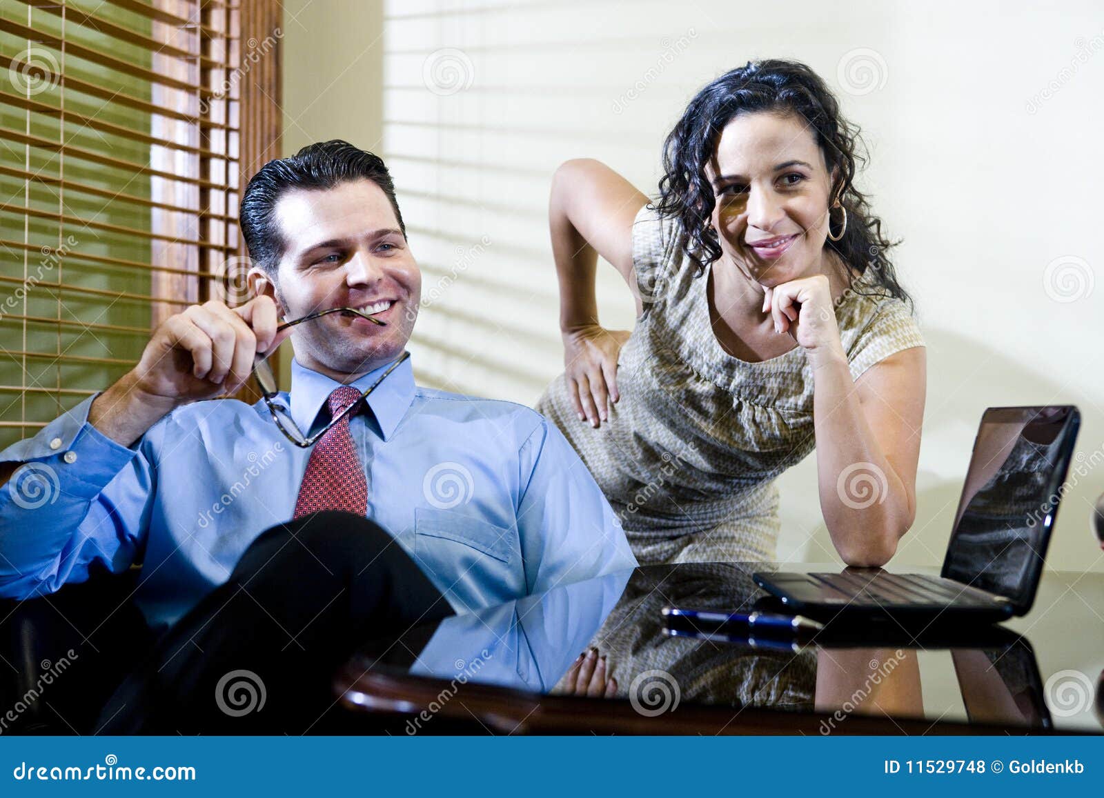 Hispanic Office Worker Working with Male Colleague Stock Photo - Image ...