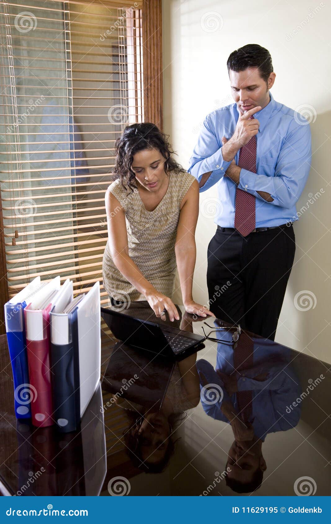 Hispanic Office Worker Working with Male Colleague Stock Image - Image ...