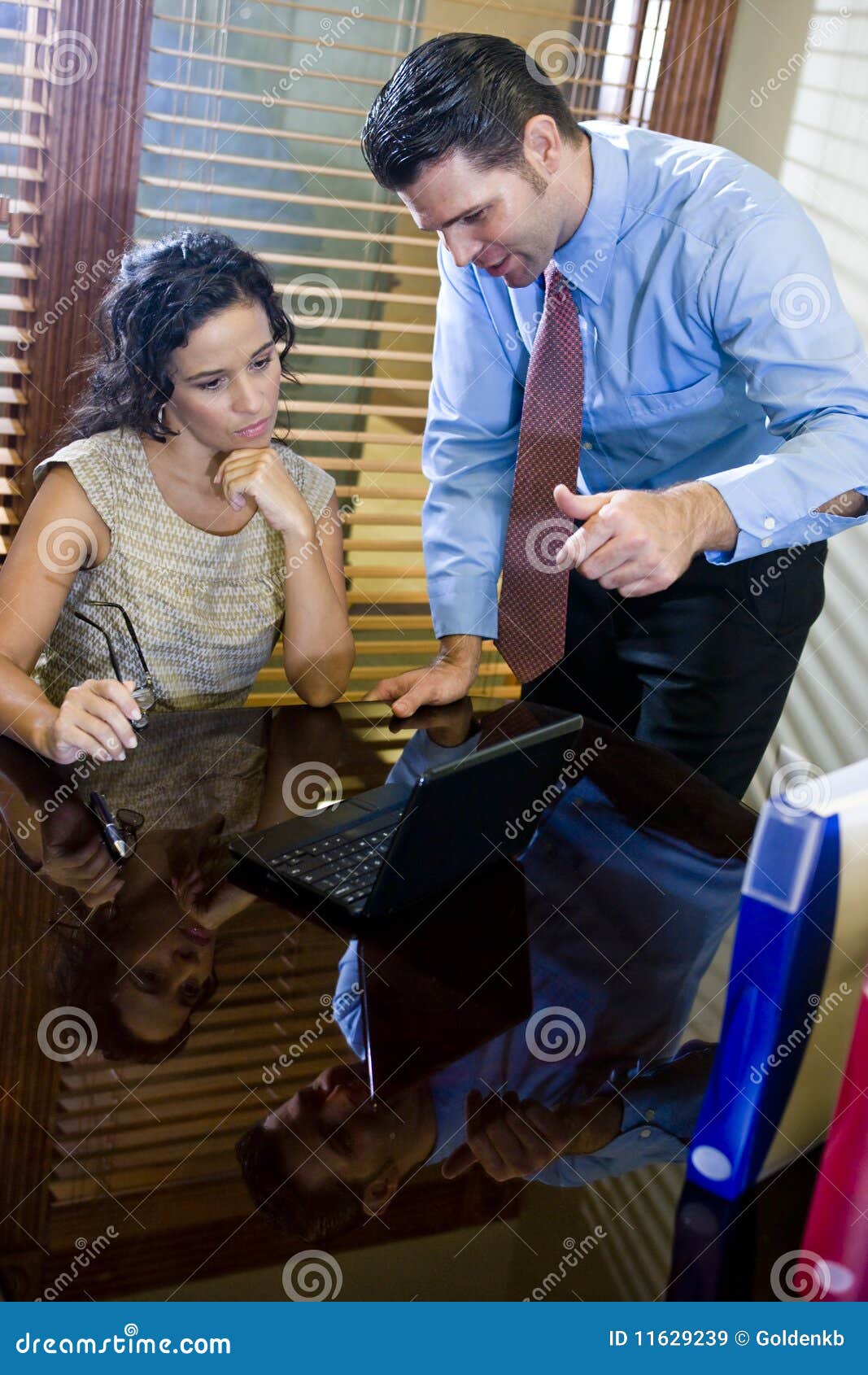 Hispanic Office Worker Working with Male Colleague Stock Image - Image ...