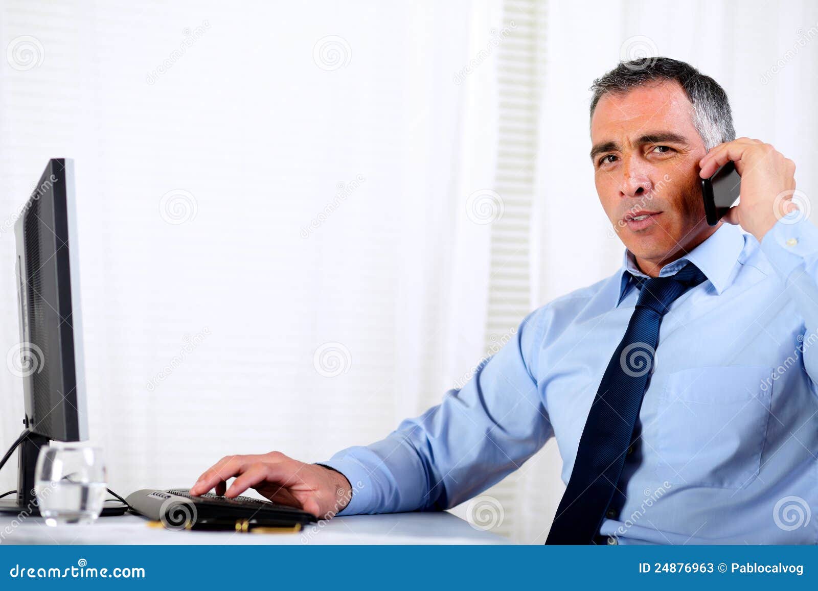 Hispanic Professional Man Conversing on Mobile Stock Image - Image of ...