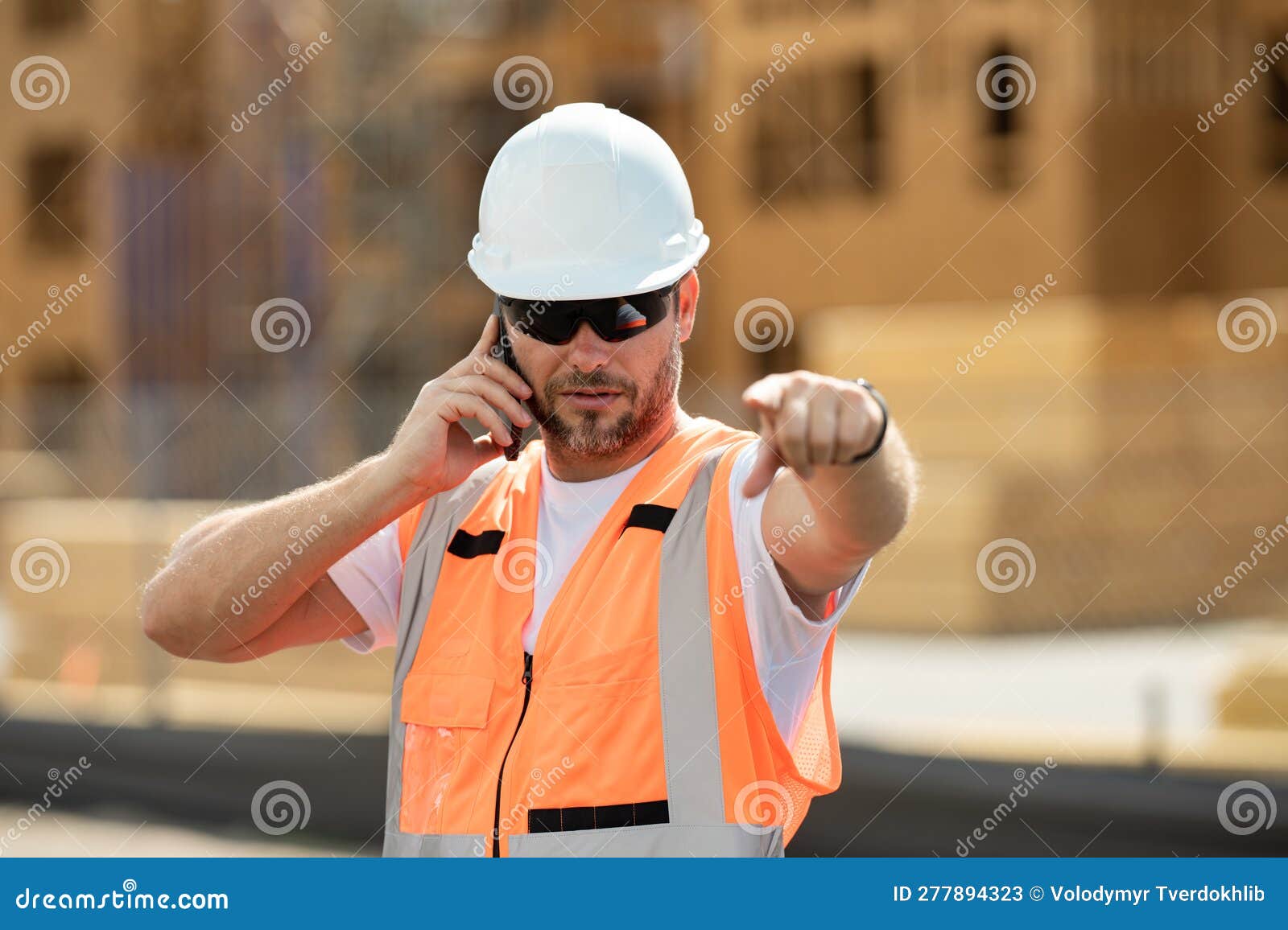 Hispanic 40 S Worker Builder Call with Phone on Site Construction ...