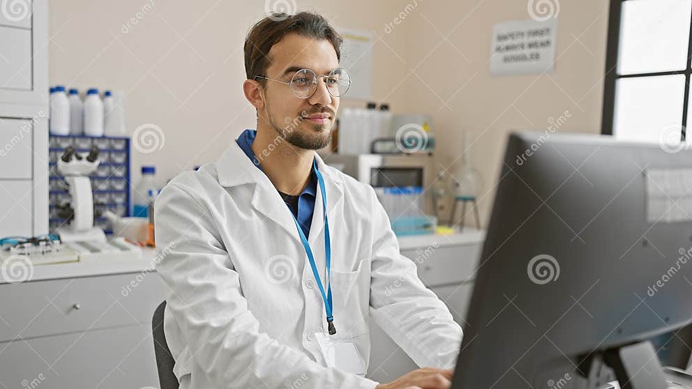 Hispanic Scientist with Beard Working at Computer in Laboratory Setting ...