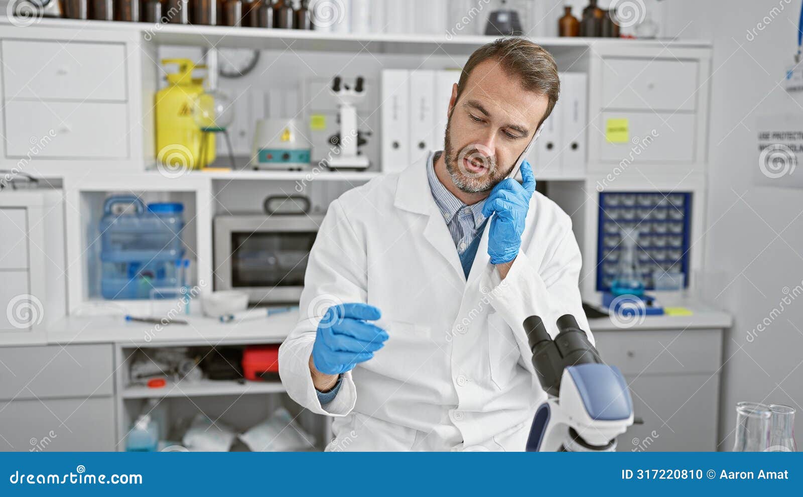 Hispanic Scientist in Lab Coat Talking on Phone in Laboratory Setting ...