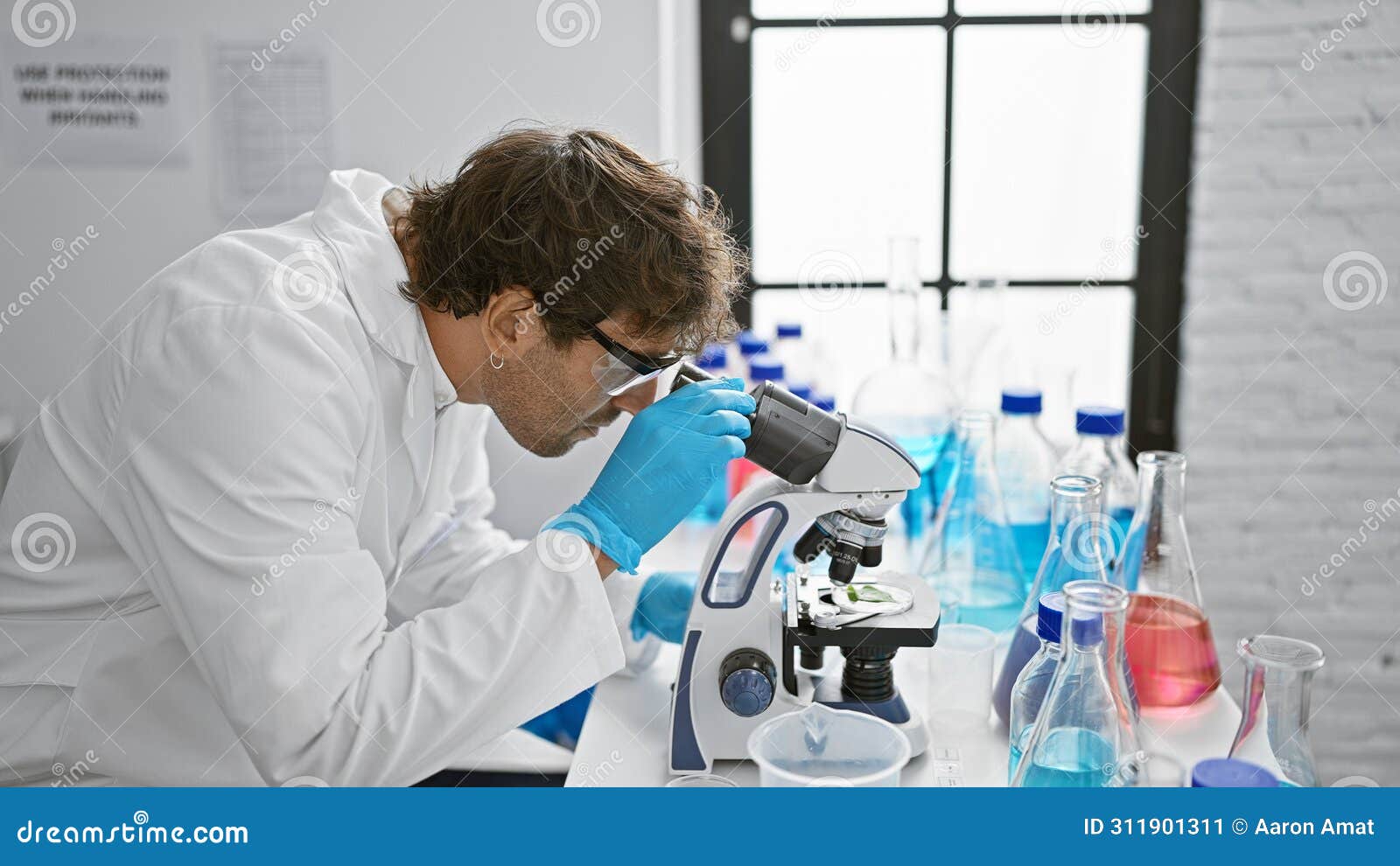 Hispanic Scientist Man with Beard Using Microscope in Laboratory with ...