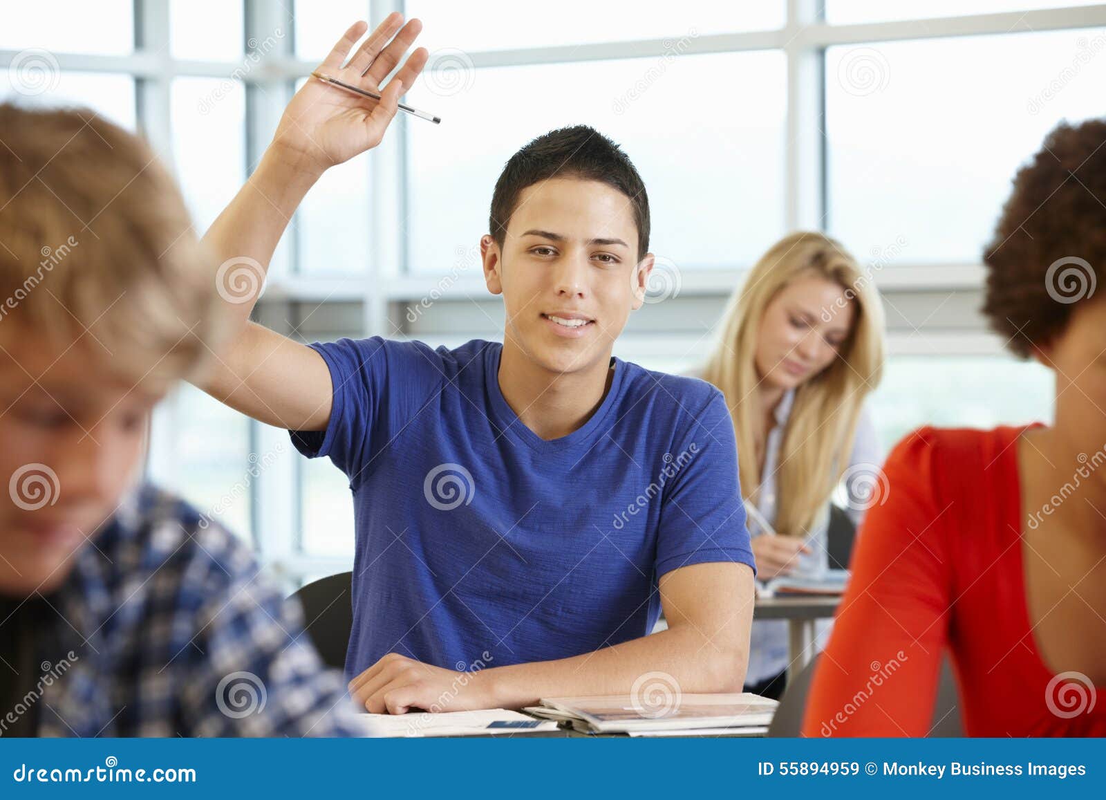 Hispanic Student Asking Question in Class Stock Image - Image of ...