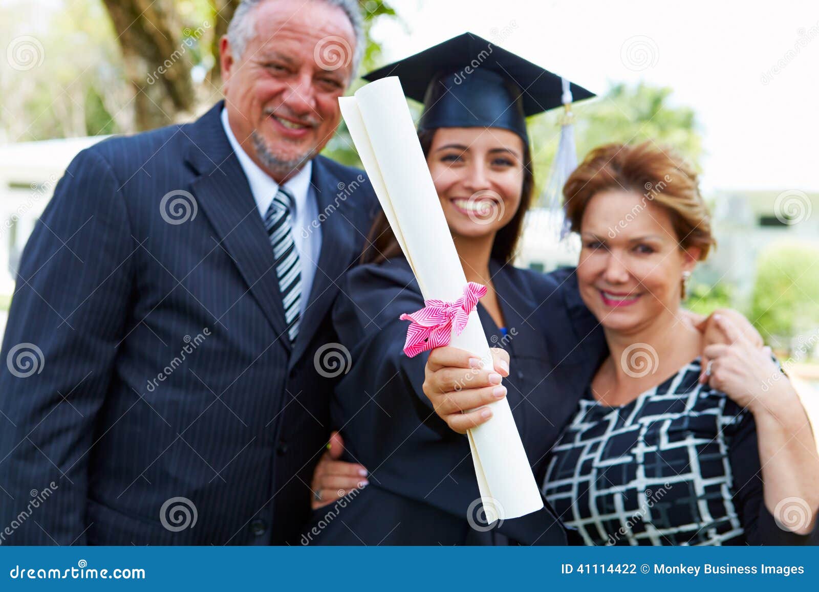 Hispanic Student and Parents Celebrate Graduation Stock Photo - Image ...