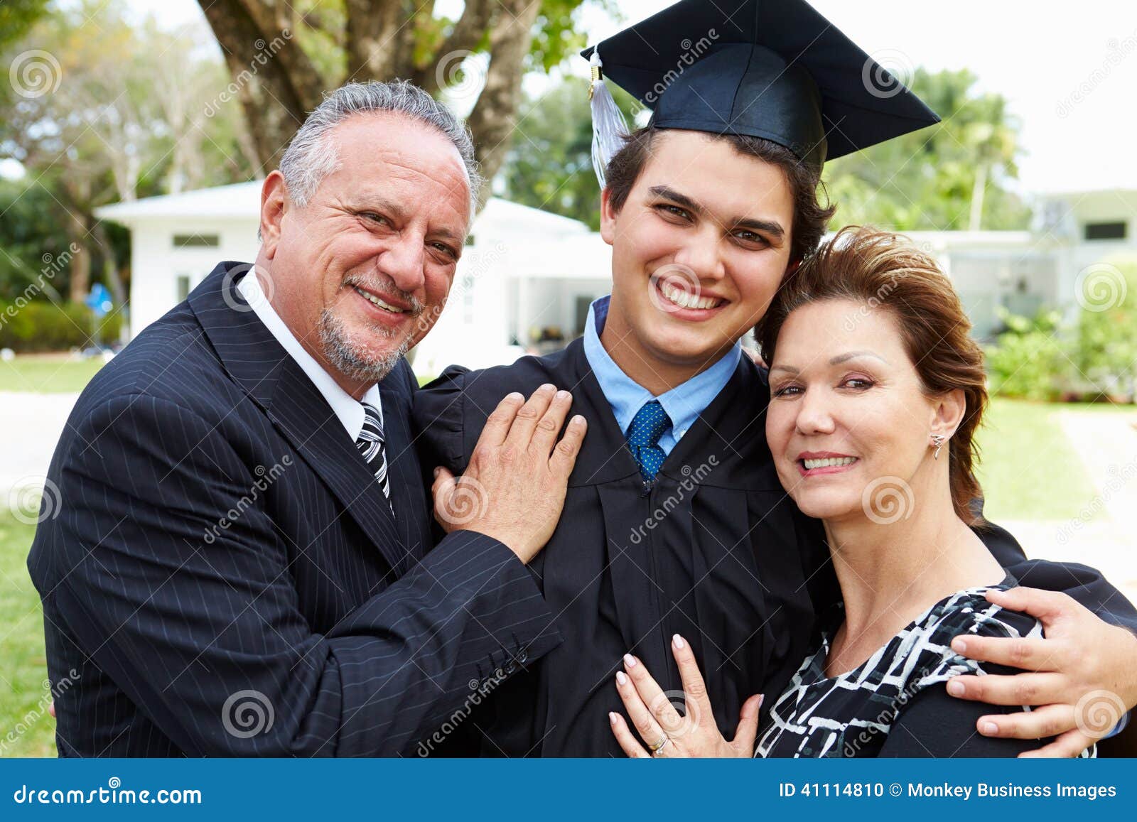 Hispanic Student and Parents Celebrate Graduation Stock Photo - Image ...
