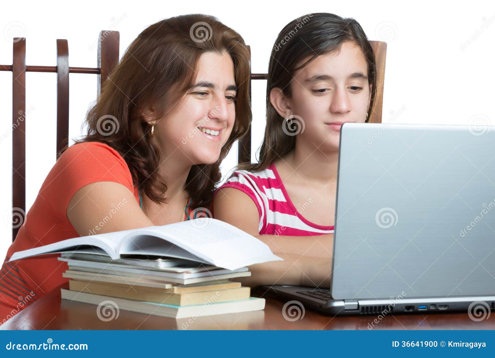 Hispanic Teen and Her Mother Working or Browsing the Web on a La Stock ...