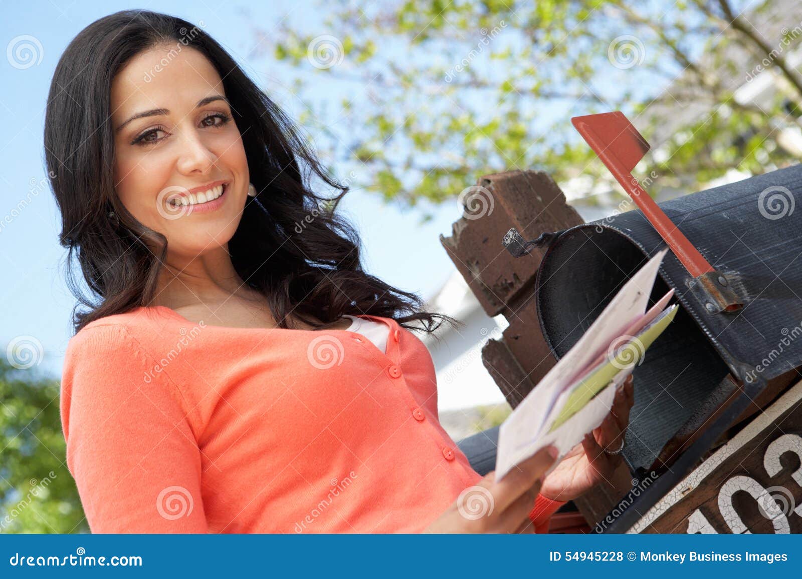 Hispanic Woman Checking Mailbox Stock Photo - Image of postbox, person ...
