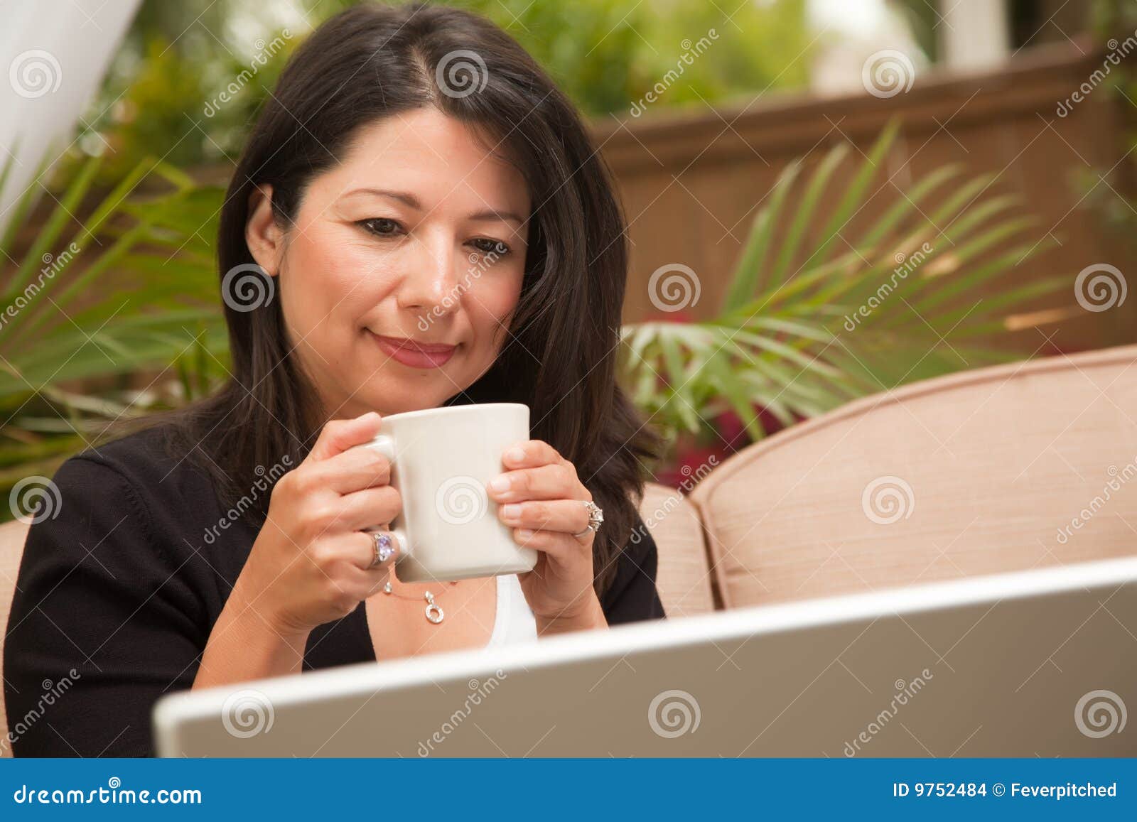 Hispanic Woman with Coffee and Laptop Stock Photo - Image of outside ...