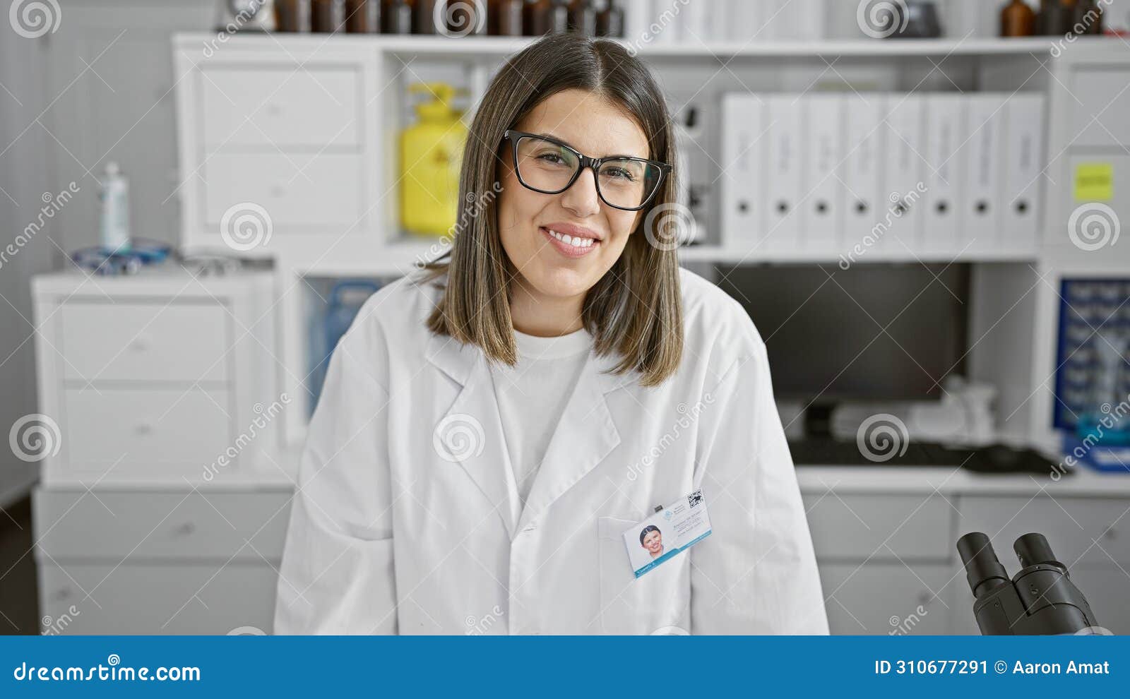 Hispanic Woman in Glasses Smiling Confidently in a Laboratory Setting ...