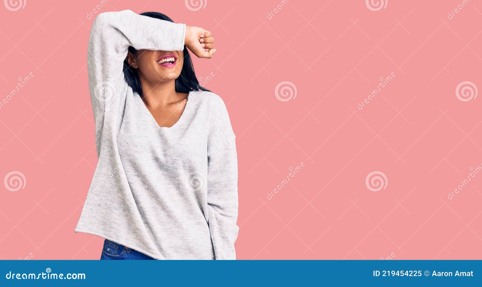 Hispanic Woman With Long Hair Wearing Casual Clothes Covering Eyes With