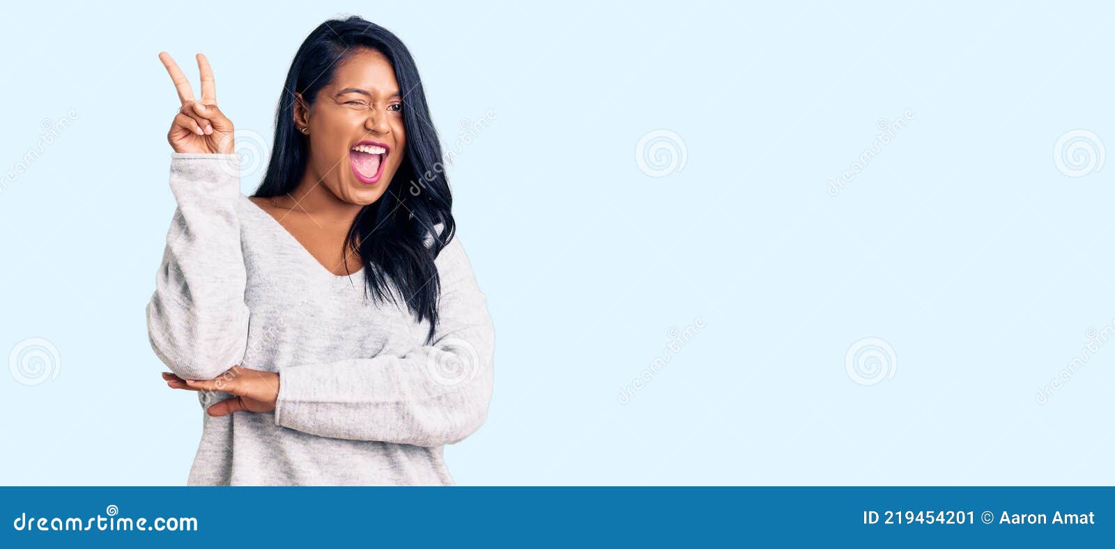 Hispanic Woman With Long Hair Wearing Casual Clothes Smiling With Happy