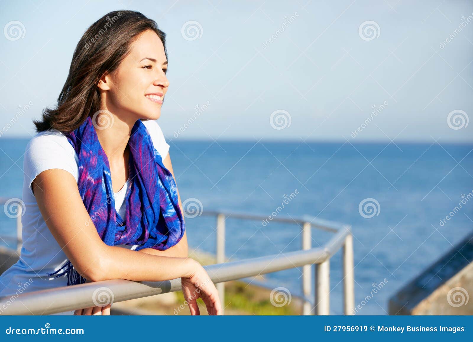 Hispanic Woman Looking Over Railing at Sea Stock Image - Image of ...