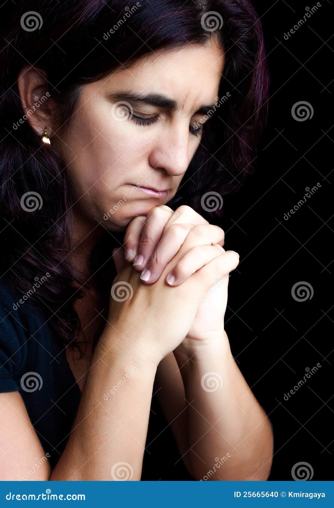 Hispanic Woman Praying Isolated on Black Stock Photo - Image of ...