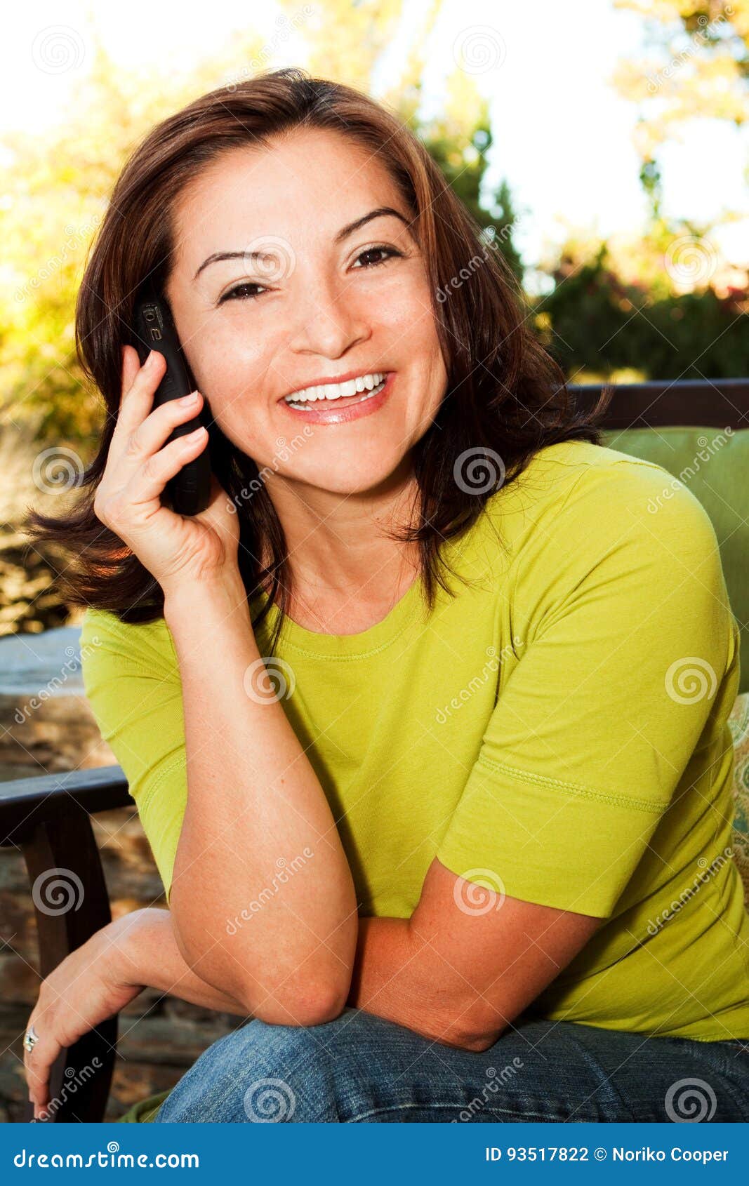 Hispanic Woman Smiling Talking on the Phone. Stock Photo - Image of ...