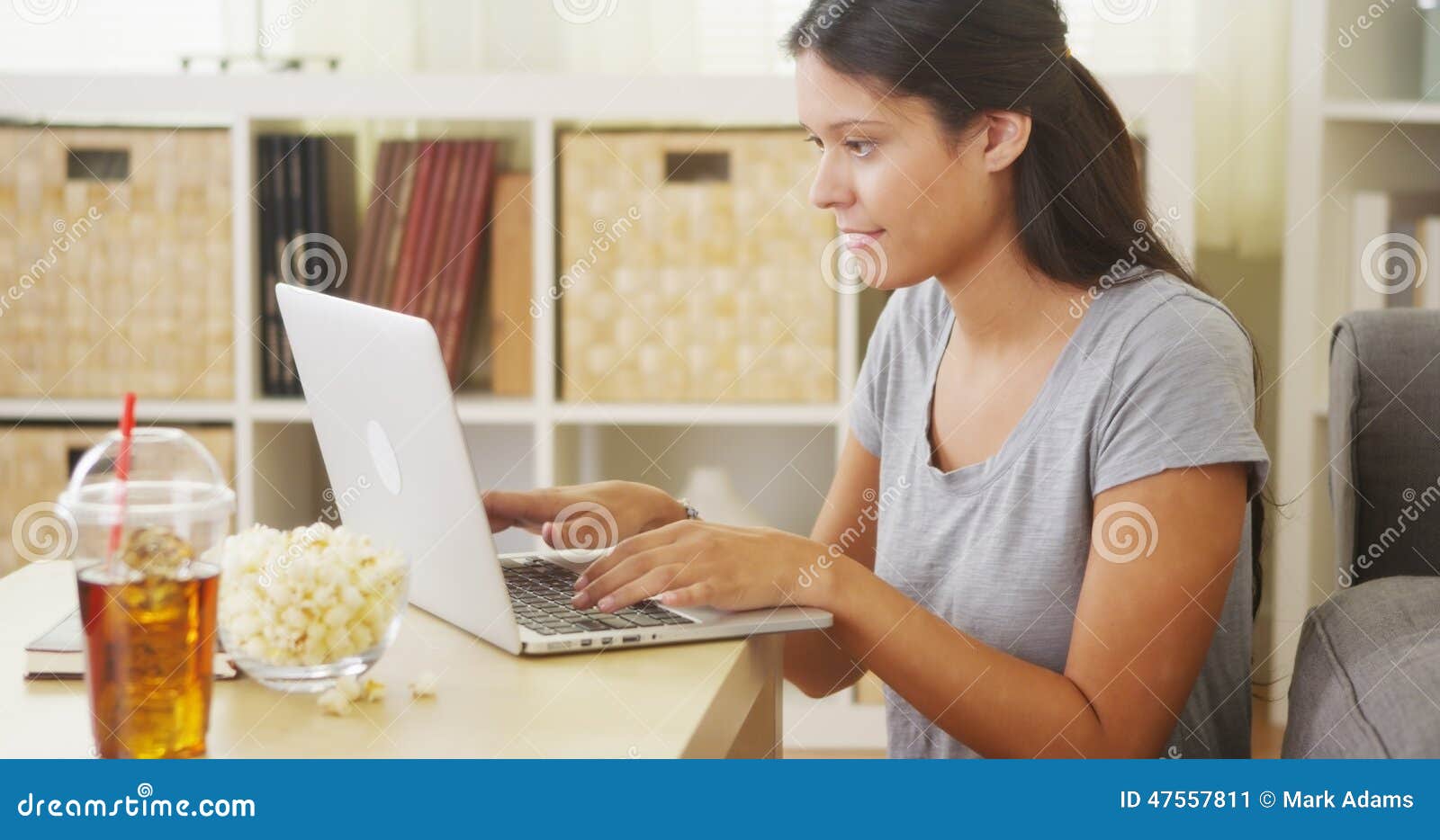 Hispanic Woman Using Laptop on Coffee Table Stock Image - Image of ...