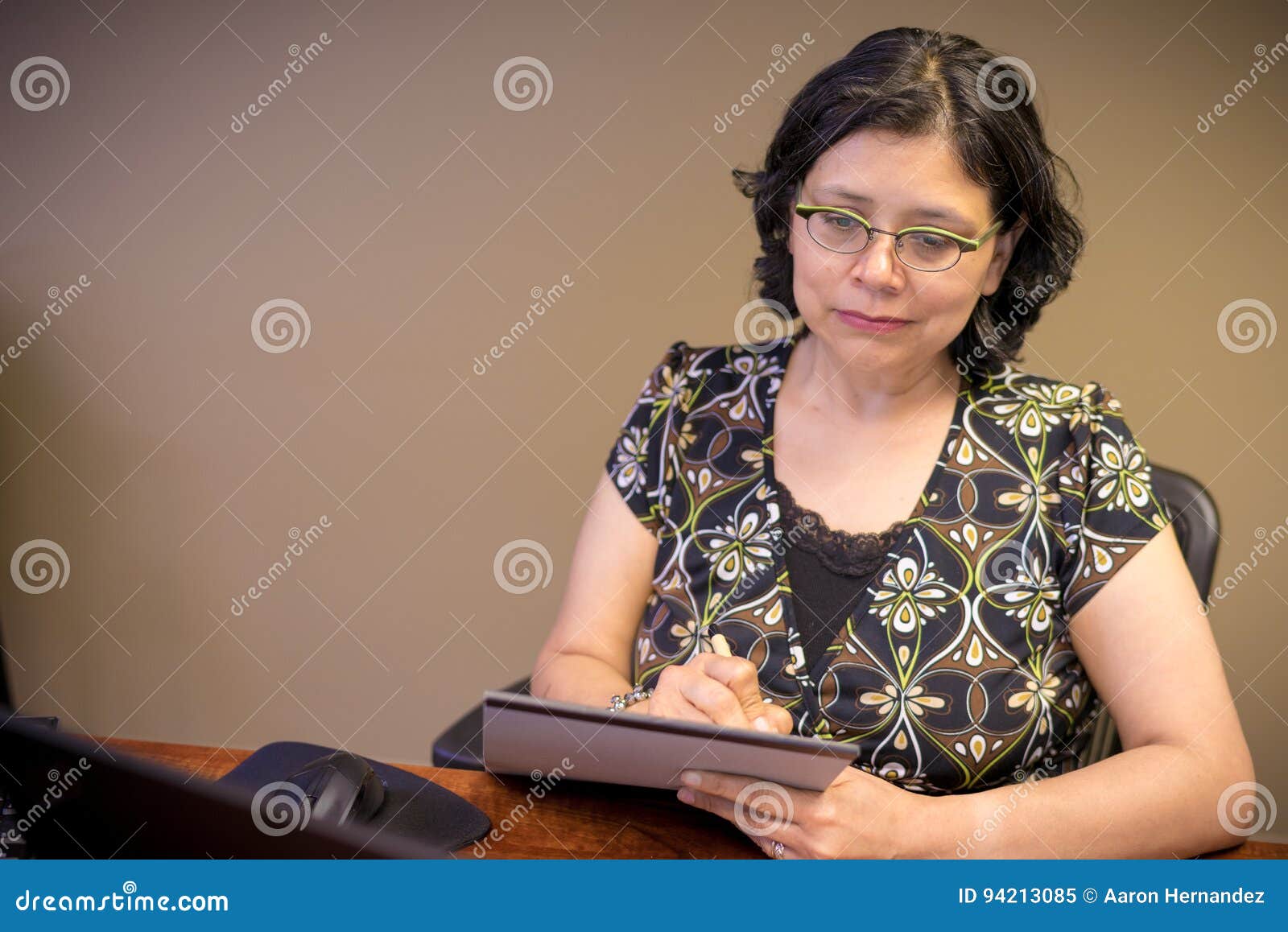 Hispanic Woman at Work Doing Desk Job Stock Image - Image of middle ...