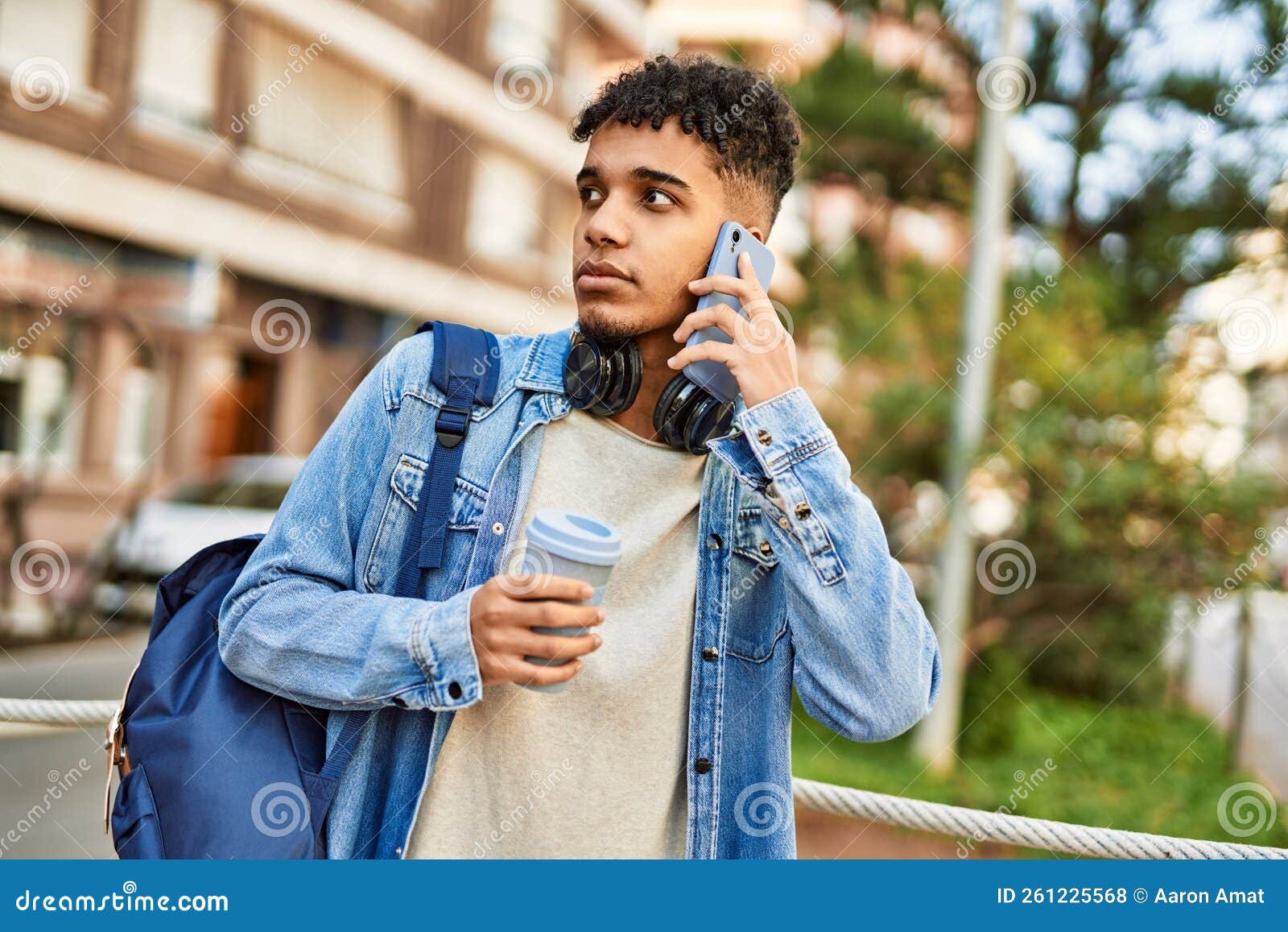 Hispanic Young Man Speaking on the Phone at the Street Stock Photo ...