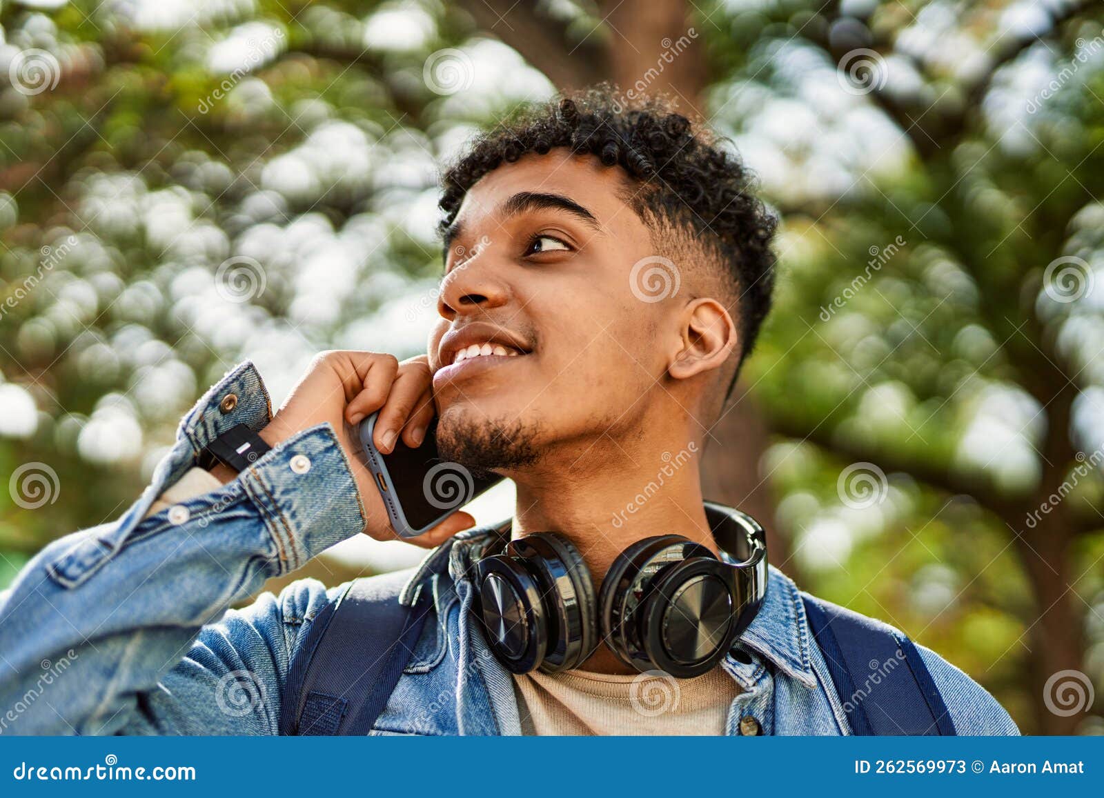 Hispanic Young Man Speaking on the Phone at the University Campus Stock ...
