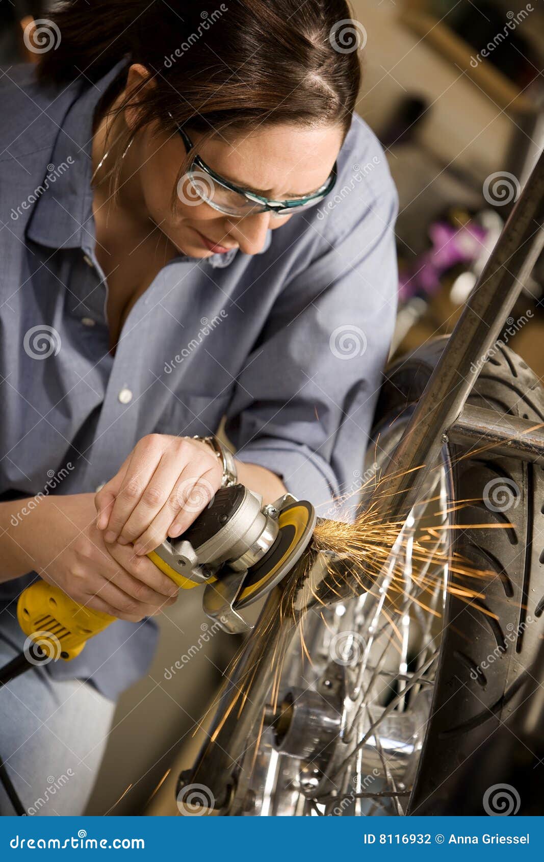Hispaninc Womman Using Grinder on Motorcycle Stock Photo - Image of ...