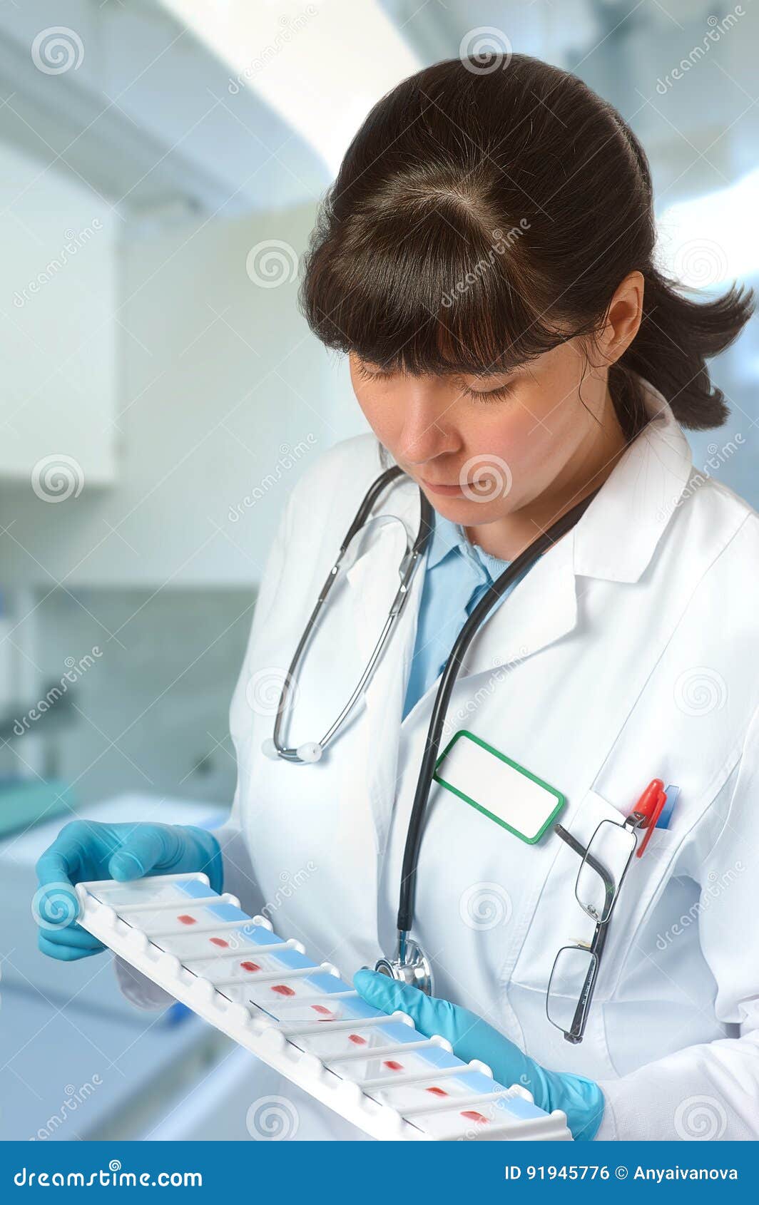 Histologist with a Microscope and a Tray of Microscopic Slides Stock ...