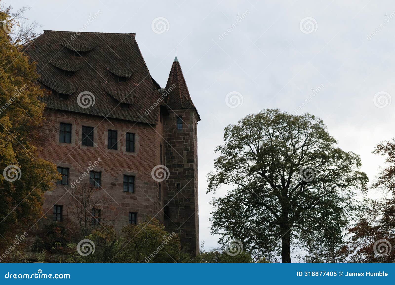 Historic Brick Castle with Tower and Trees Stock Image - Image of ...