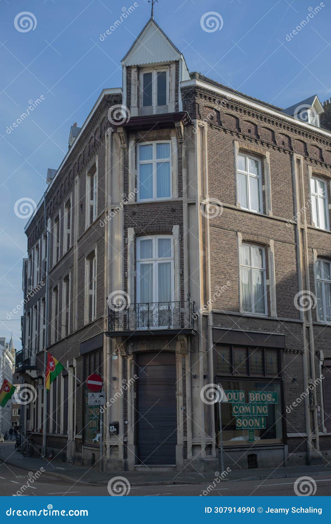 Historic Corner Building with Elegant Architecture and Flags in the ...