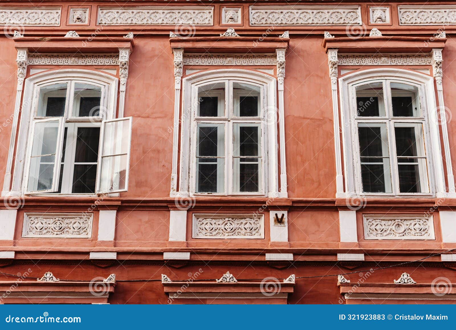 Historic European Building Facade Featuring Elegant Windows and ...