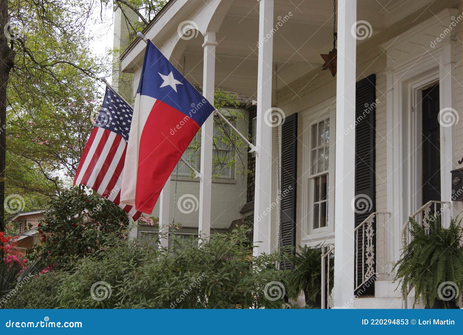 Historic Home with Texas and American Flags Stock Image - Image of ...