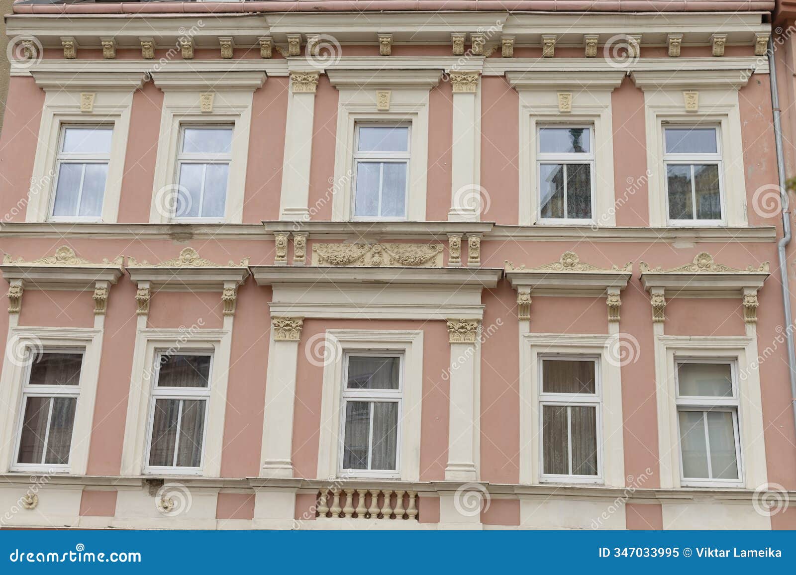 Historic Pink Building Facade with Windows and Architectural Details ...