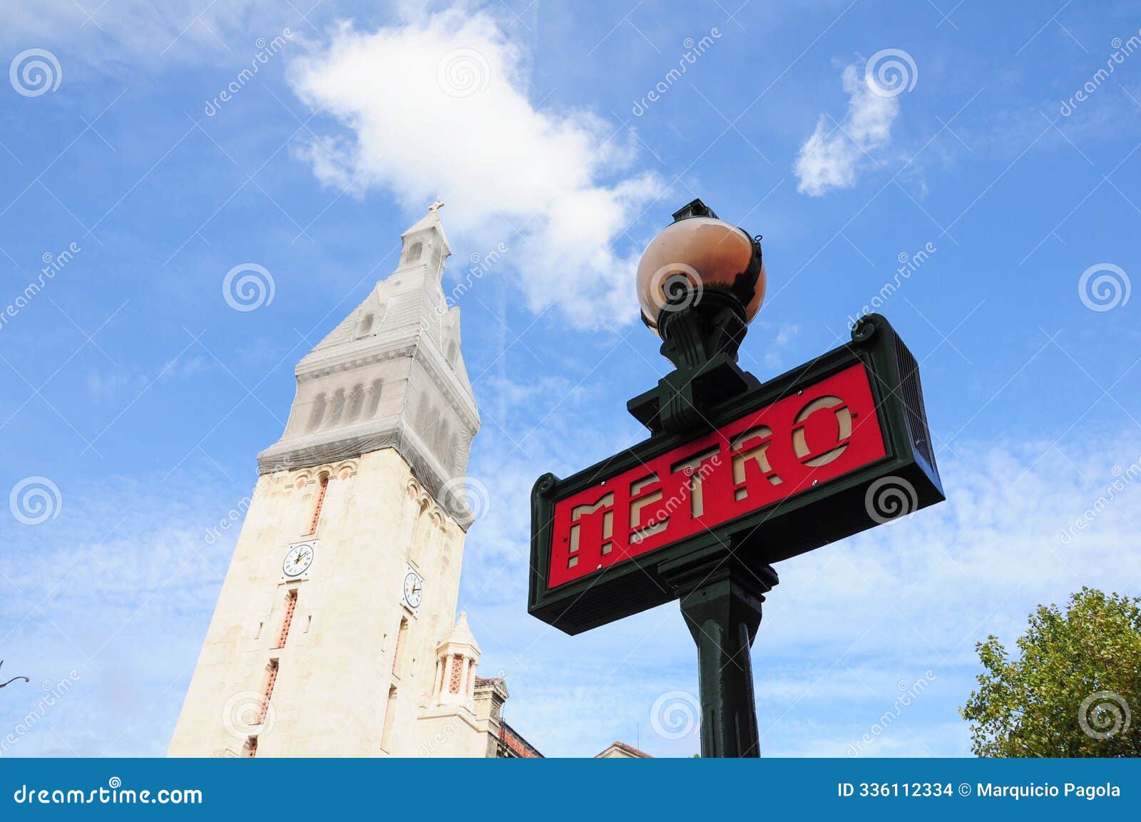 Historic Tower and Red Metro Sign Under Clear Blue Sky in Paris Stock ...