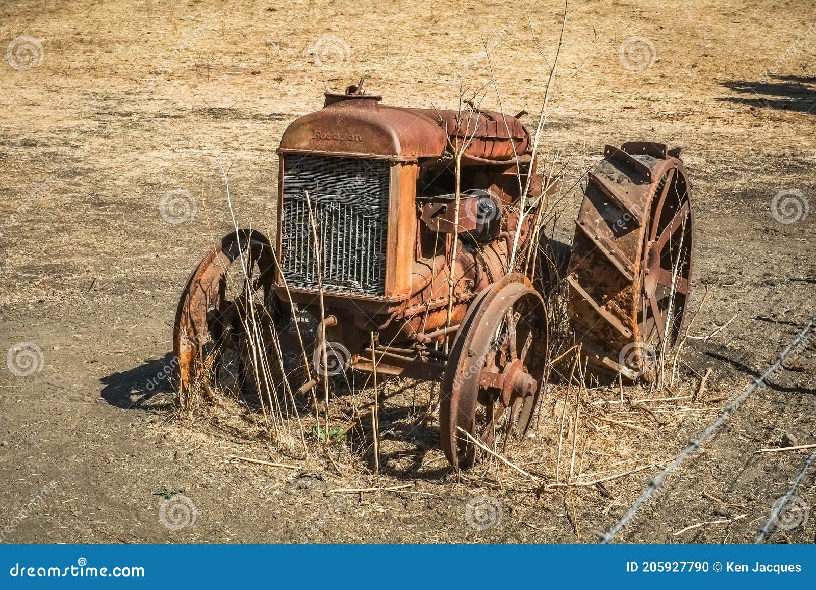 Historic Tractor Rusting in Open Field Fenced Stock Photo - Image of ...