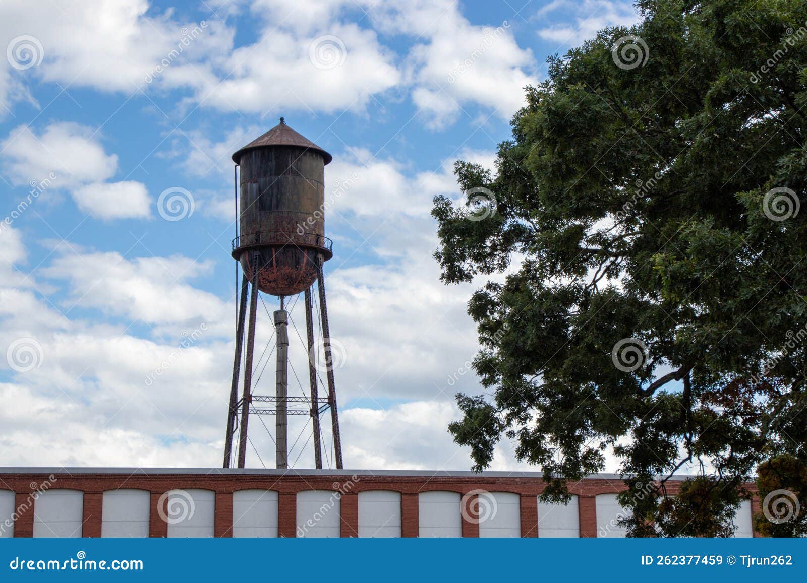 Old water tower in the sky stock image. Image of historic - 262377459