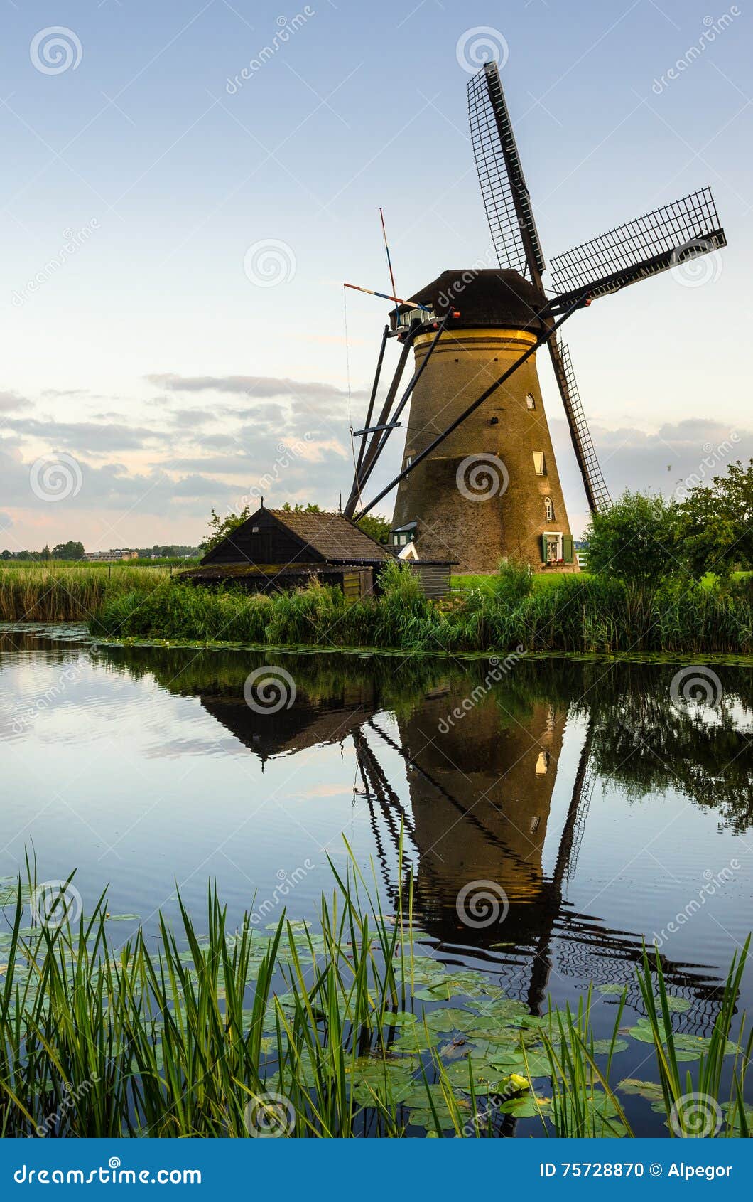 Historic Windmill at Sunset Stock Photo - Image of architecture, green ...