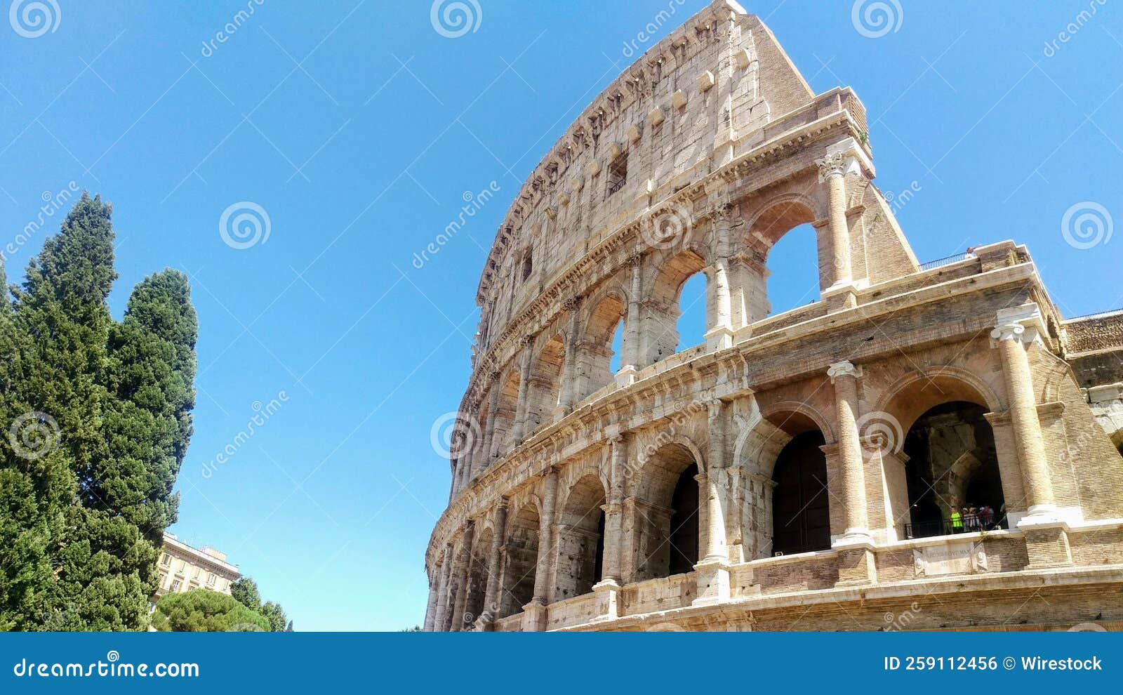 The Historical Colosseum in Rome with a Blue Sky Stock Photo - Image of ...