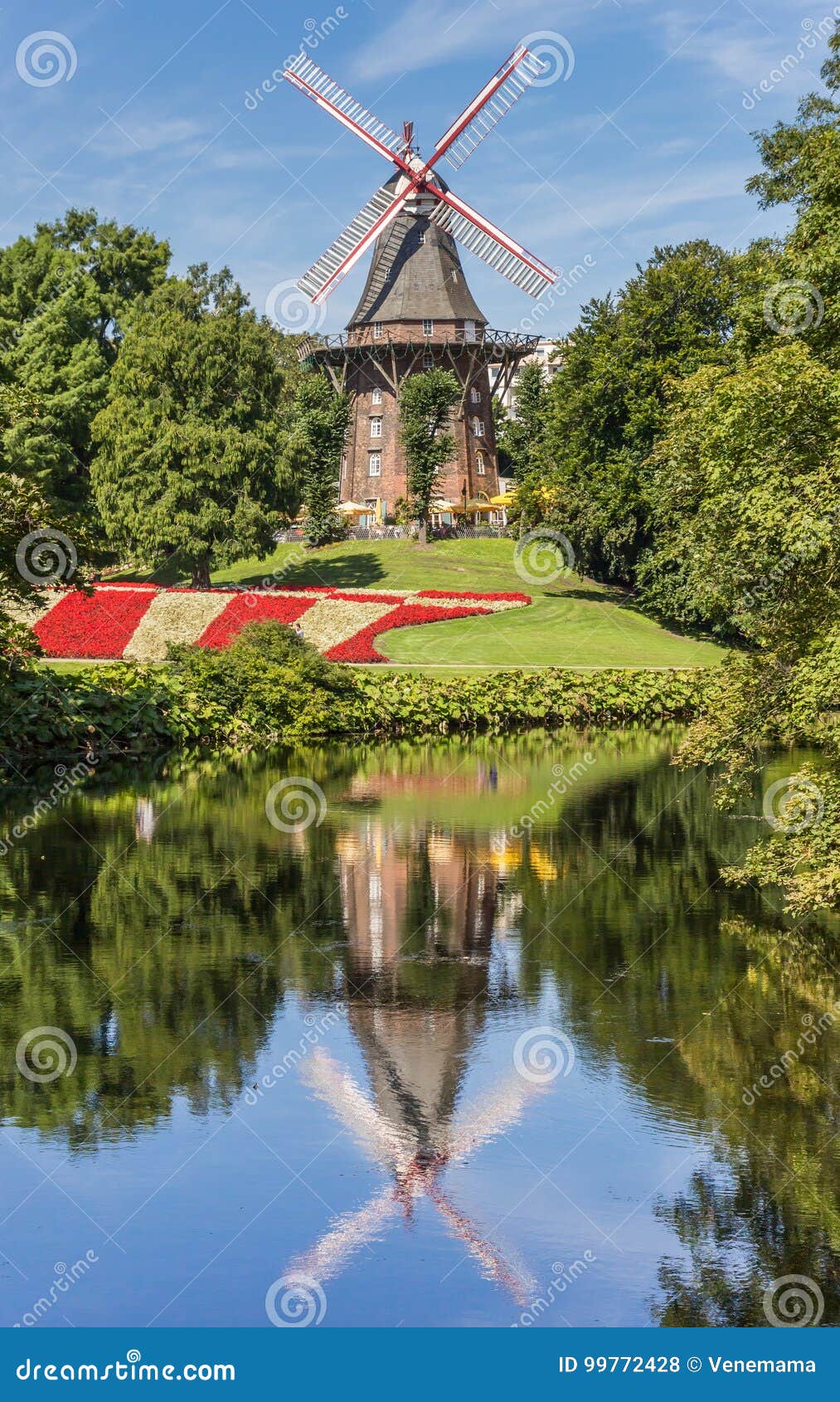 Historical Windmill with Reflection in the Water in Bremen Stock Photo ...