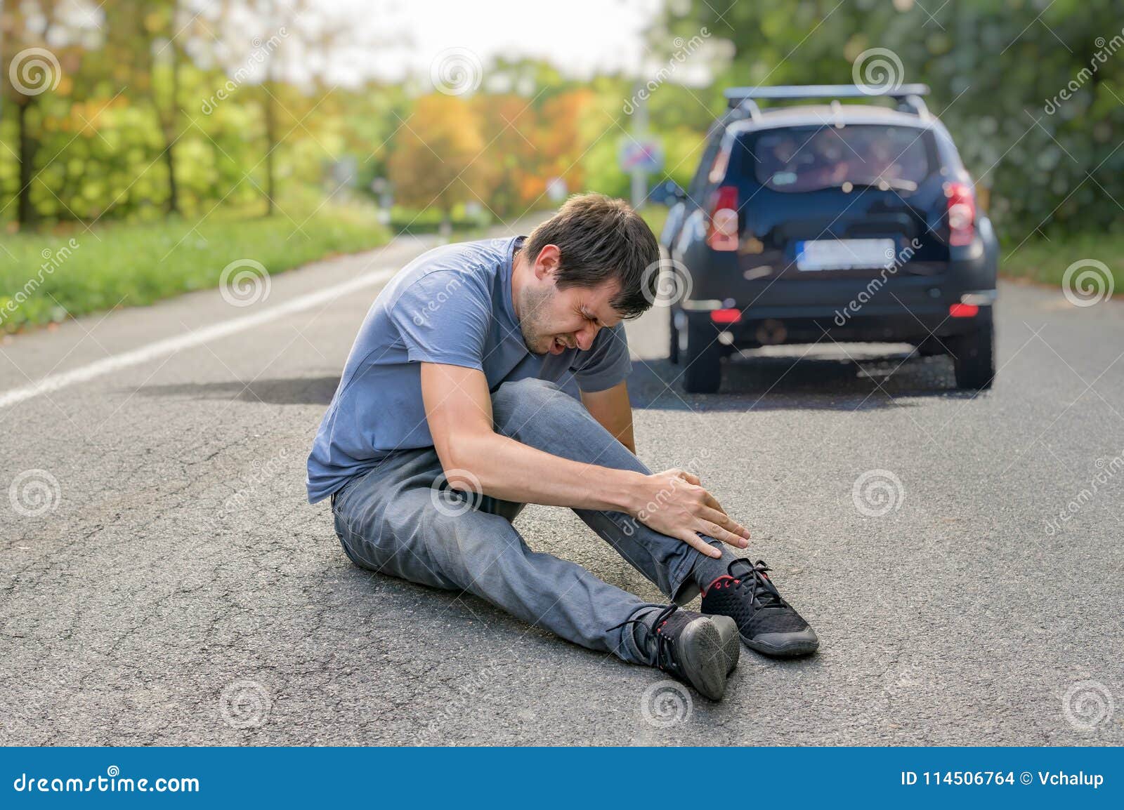 Hit and Run Concept. Injured Man on Road in Front of a Car Stock Photo ...