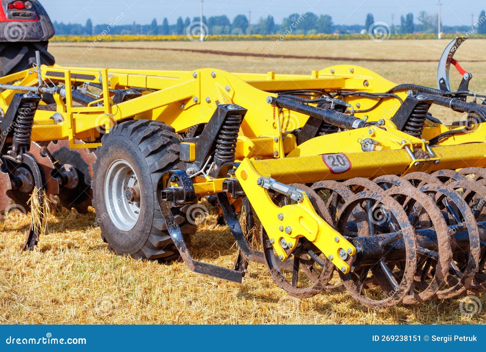 Hitch of a Powerful Multi-row Disc Harrow with a Tractor on the ...