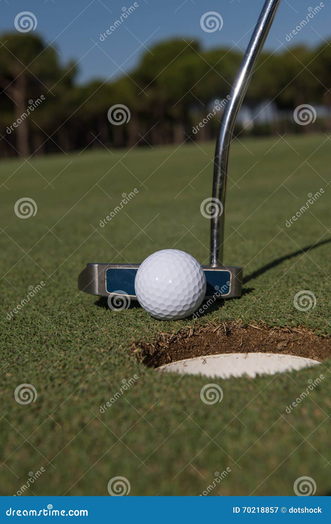 Hitting golf ball to hole stock image. Image of space - 70218857