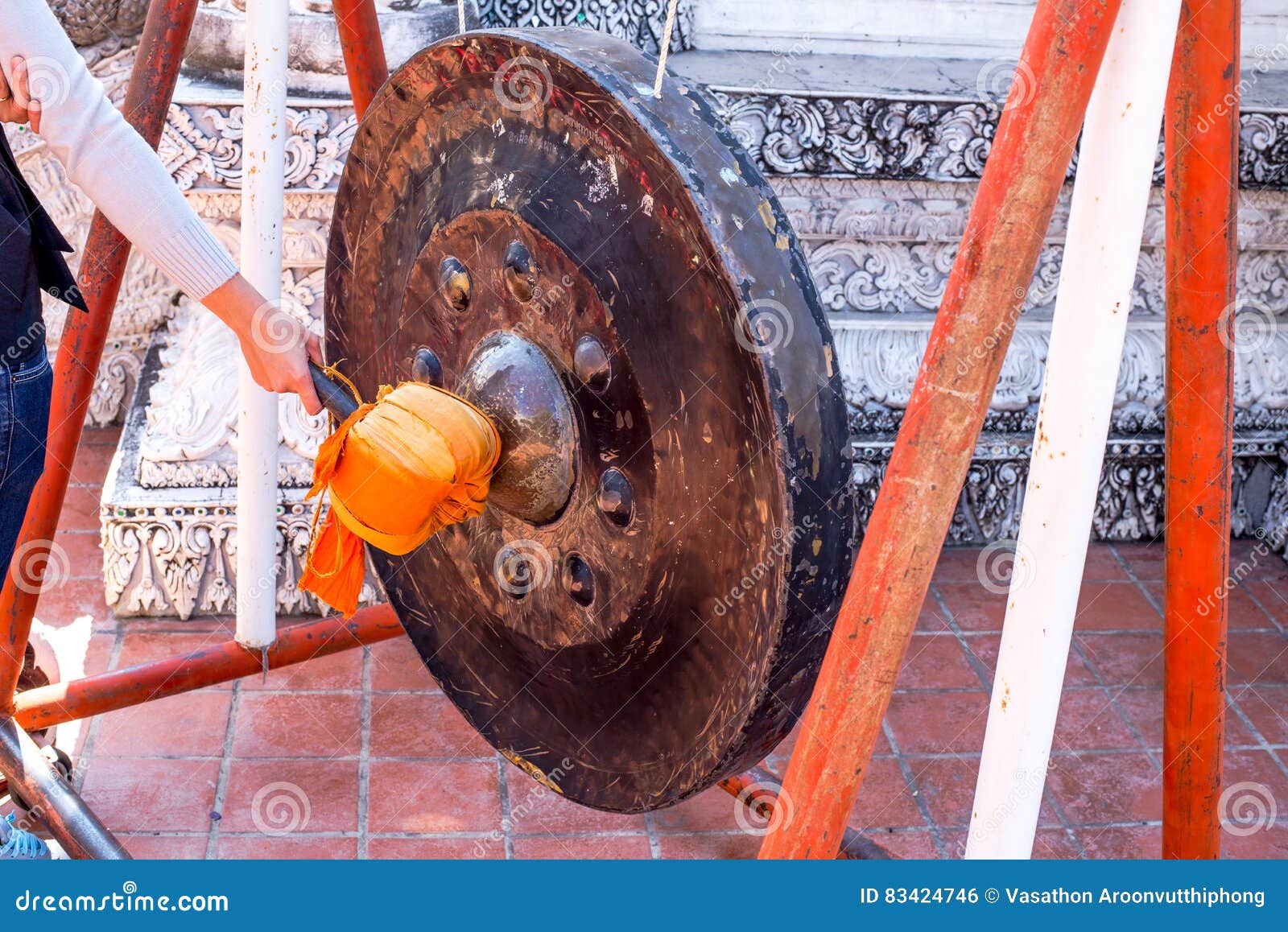 Hitting gong in the temple stock photo. Image of buddhist - 83424746