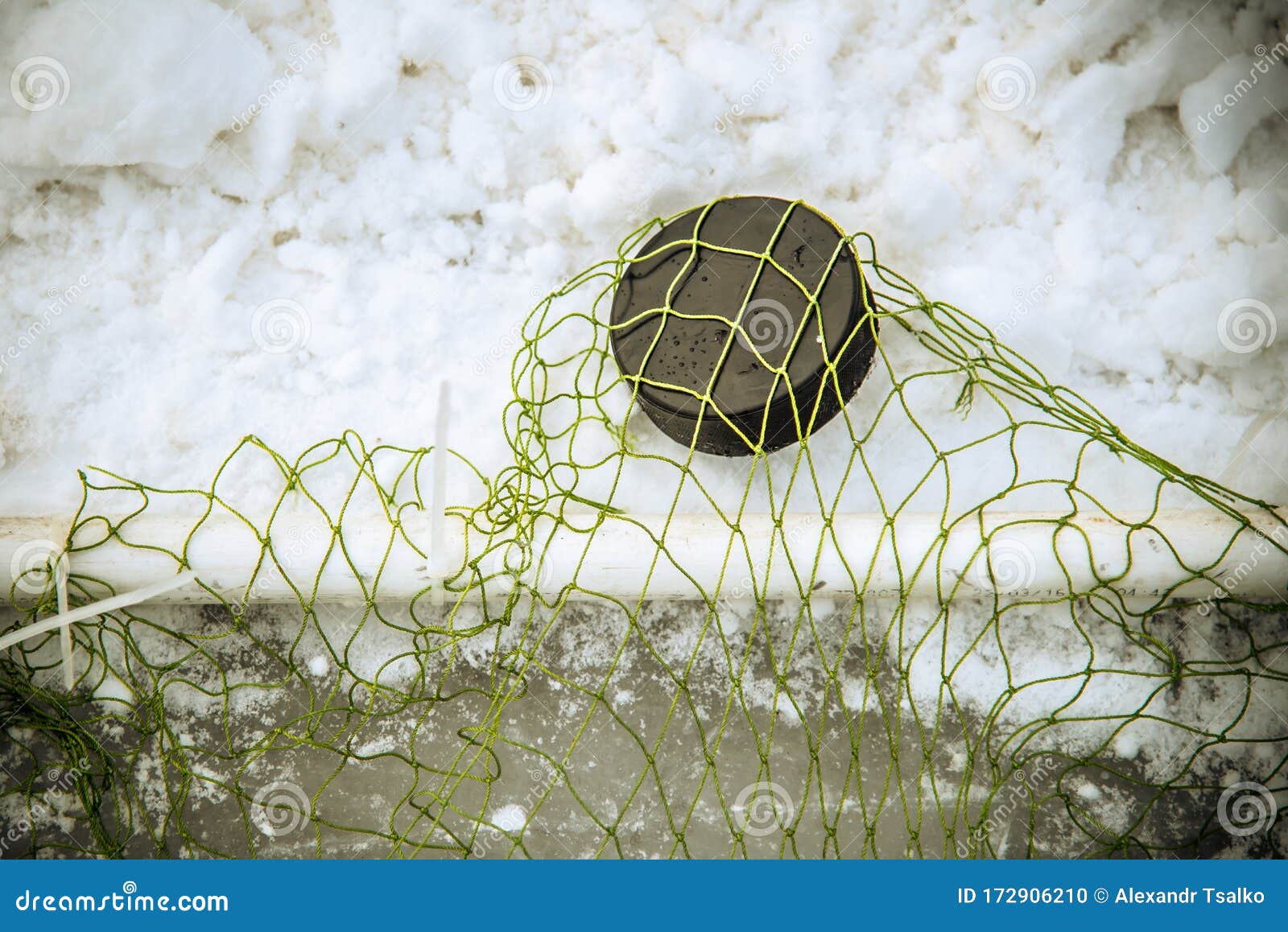 Hockey Puck in the Goal Net Close-up Stock Photo - Image of ...