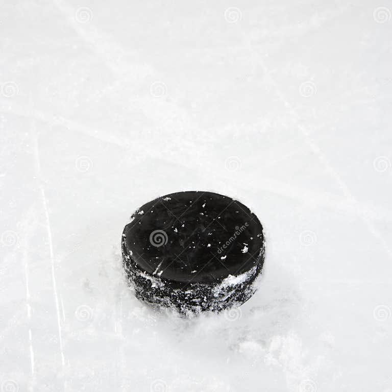 Hockey puck on ice. stock photo. Image of sports, color - 2676912
