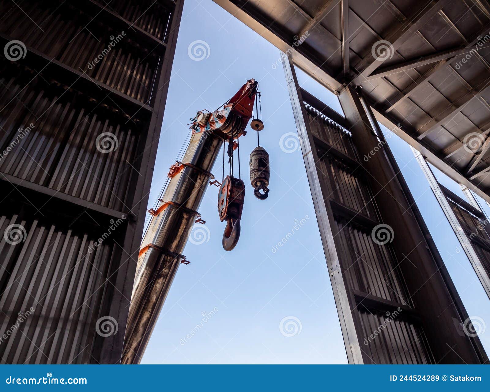 Hoist of Crane at the Window of Industrial Plant Stock Image - Image of ...