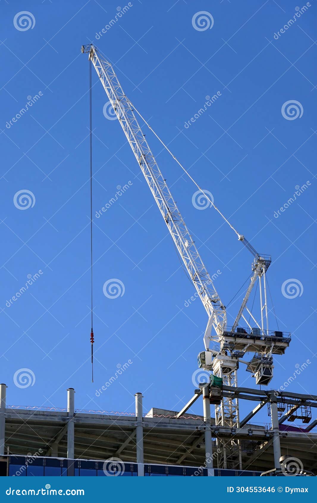 Hoisting Tower Crane on the Top Section Being Constructed of Modern ...